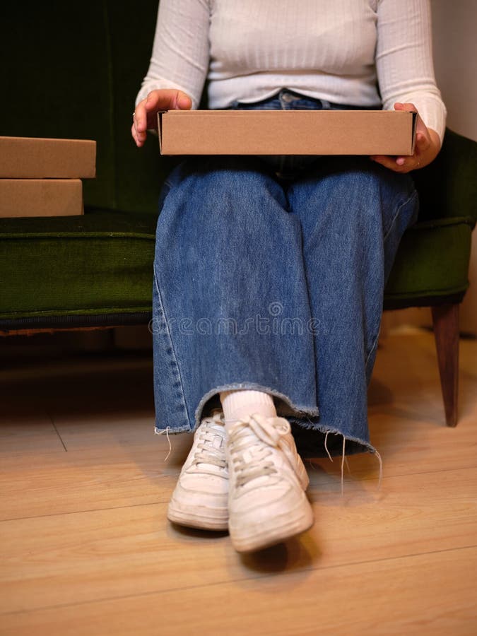 View from Below of a Girl Sitting with a Box on Her Legs Stock Image ...