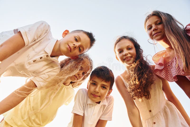 View from Below of Group of Kids that Looking Down and Having Fun Stock ...
