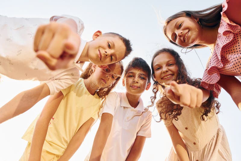View from Below of Group of Kids that Looking Down and Having Fun Stock ...