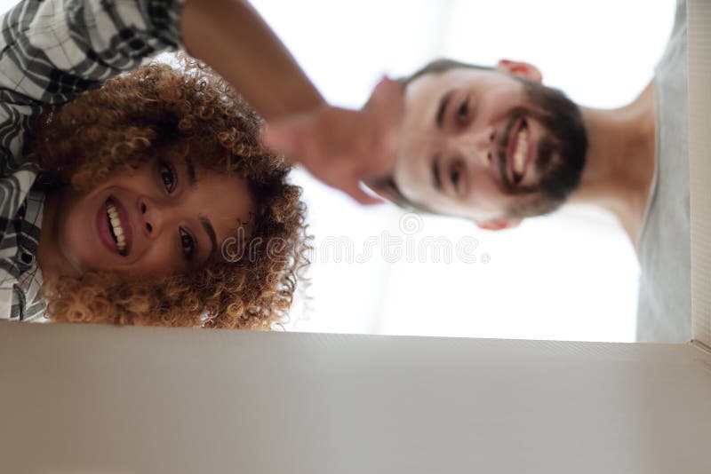 View from Below Husband and Wife Looking Inside the Box. Stock Photo ...