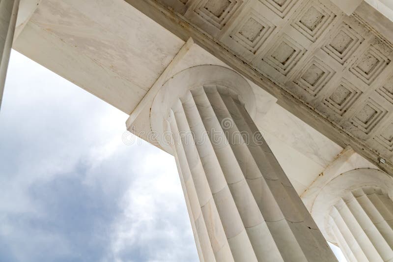 View from Below of Marble White Columns Against the Sky Stock Photo ...