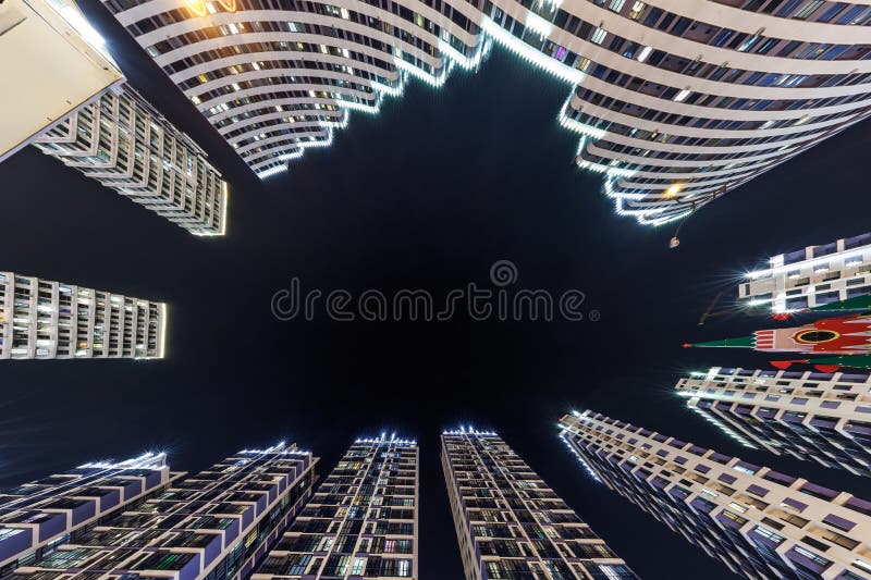 View from Below into Night Sky of Large Modern Skyscraper Residential ...