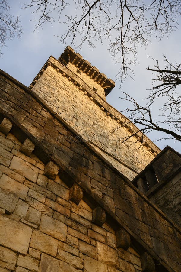 A View from Below of an Old Stone Tower Illuminated by the Rays of the ...