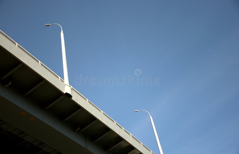 View from Below on a Part of the Bridge with Lighting Poles and Clear ...
