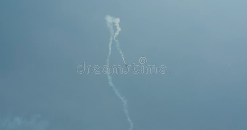 A View from Below of the Sky Where a Plane is Falling, a Trail Trailing ...