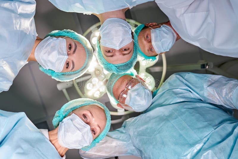 View from Below on Team of Caucasian Surgeons in Operating Room Stock ...