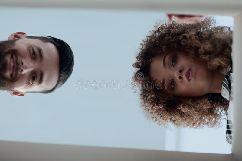 View from Below a Young Couple Looking Inside the Box. Stock Photo ...