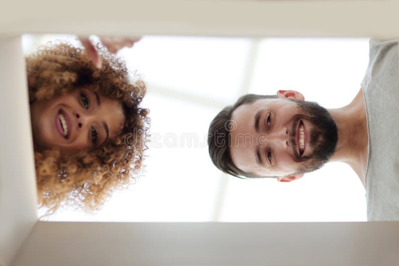 View from Below a Young Couple Looking Inside the Box. Stock Image ...