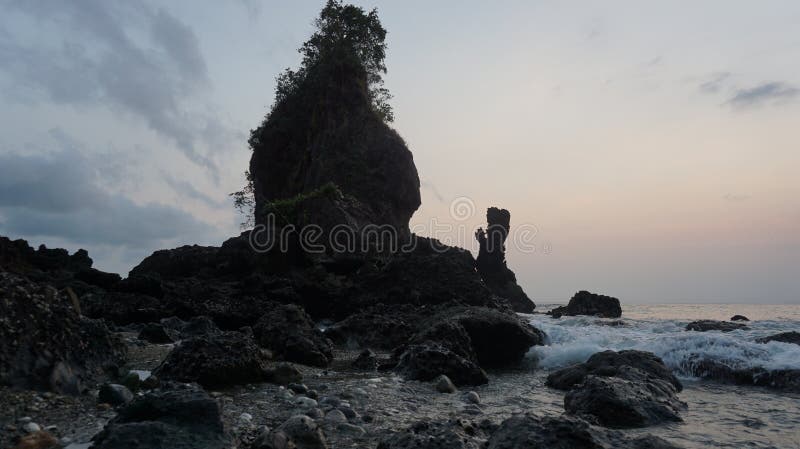 The View of the Big Rock by the Beach at Sunset Stock Photo - Image of ...