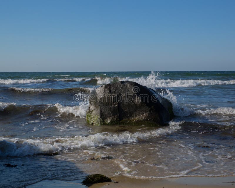 View of Big Waves Hitting the Big Rock on the Beach Stock Photo - Image ...