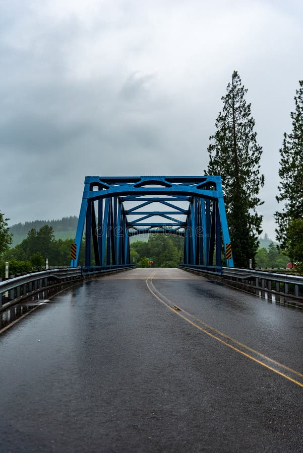 A View of a Blue Bridge on a Cloudy Afternoon. Stock Image - Image of ...