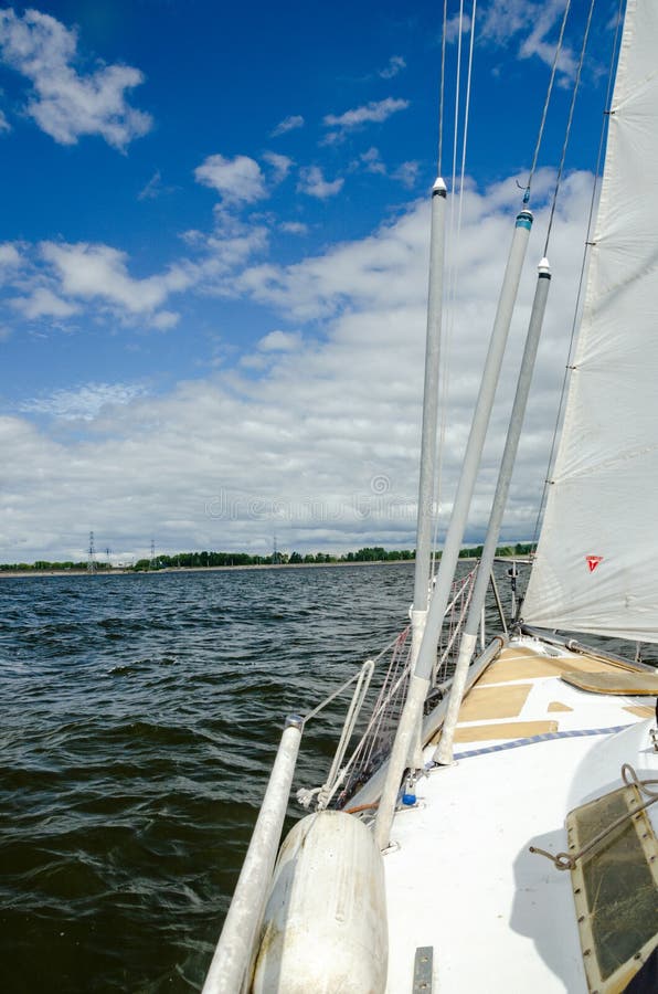 View of the Blue Sea Water from the Side of a Sailboat with Rigging and ...
