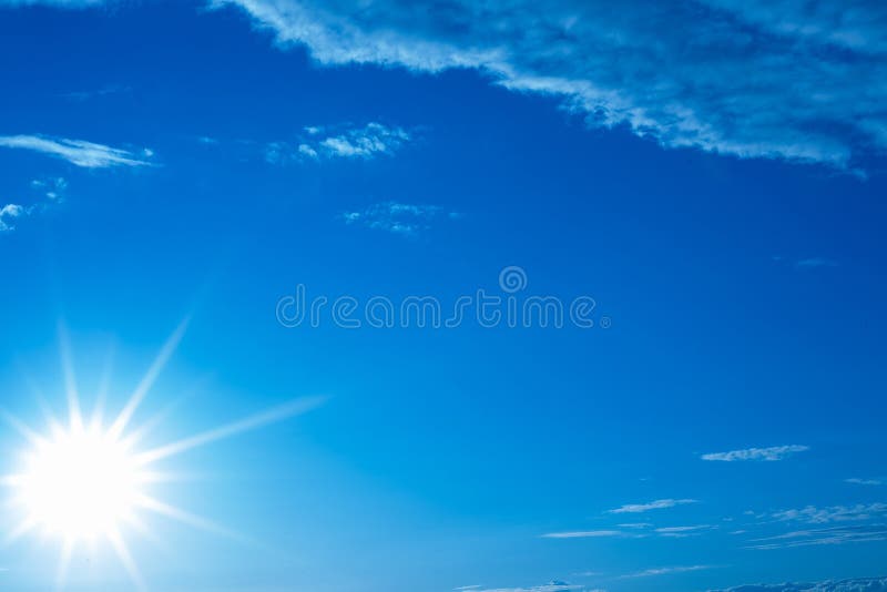 View of the Blue Sky with Few Clouds and the Bright Sun Stock Photo ...