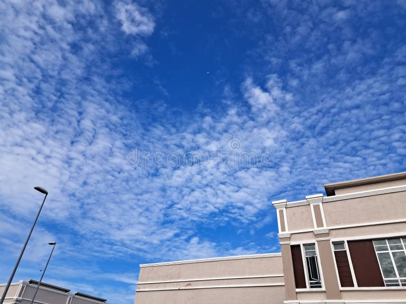 A View of Blue Sky and White Clouds with Brown Beige Old Buildings with ...