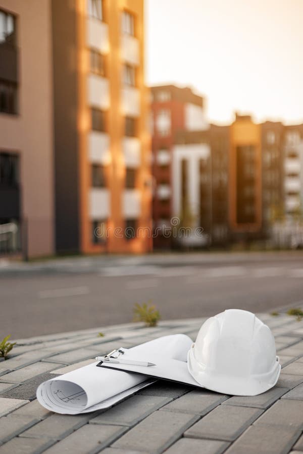 View on Blueprint, Protective White Hard Hat and Clipboard Folder with ...