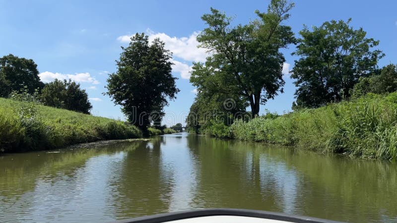 Boat Floating in a Navigable Canal. Stock Video - Video of creek, fall ...