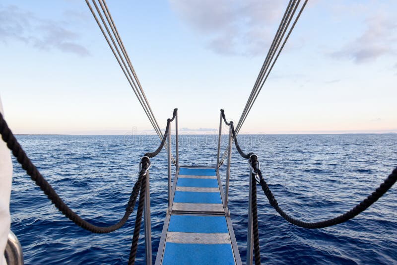 View from a Boat with Ladder Suspended Over Ocean Water Stock Photo ...