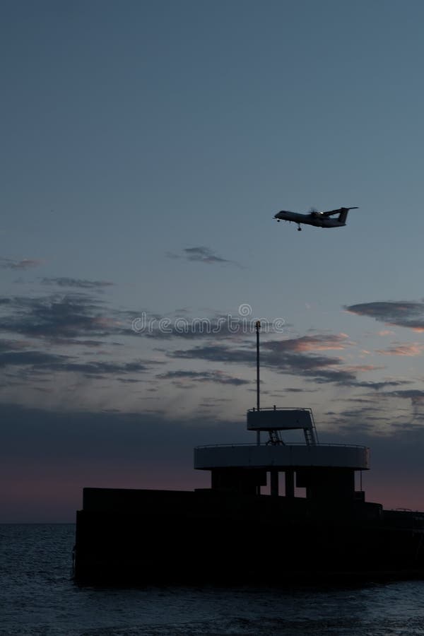 View of a boat and a plane stock image. Image of coast - 345756509