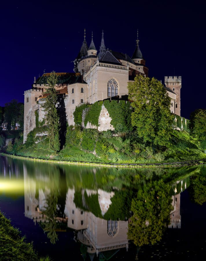 View of the Bojnice Castle with Reflections in the Water at Night ...