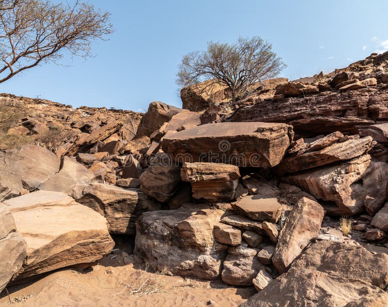 A View of a Boulder Strewn Side of the River Valley at Twyfelfontein in ...