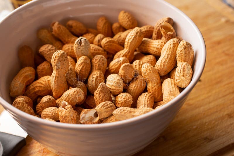 Bowl of whole peanuts stock image. Image of shell, shelf - 240465957