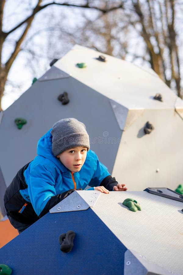 View of a Boy in a Blue Jacket on a Climbing Wall, Wall Climbing ...