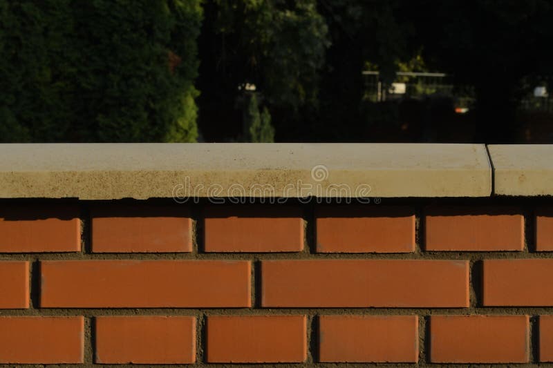 View of the Brick Base. Brick Exterior Wall with White Finished Top ...