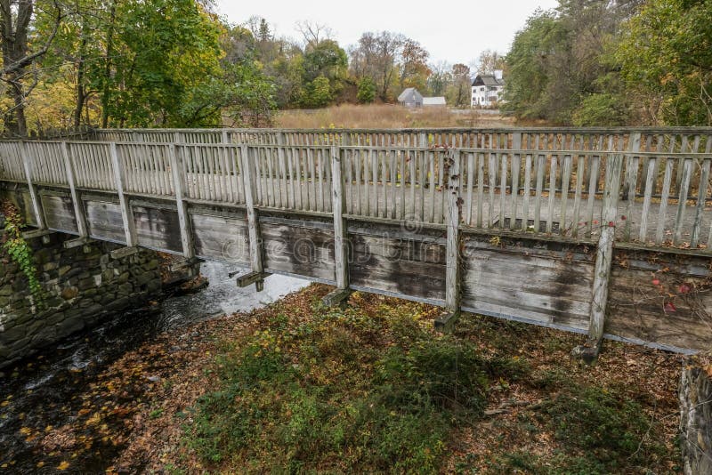 Bridge over the stream stock photo. Image of autumn - 261477496