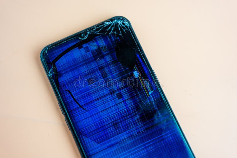 The Broken Screen of a Smartphone with Numerous Cracks Stock Image ...