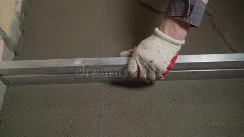 View of Builder Hands Plastering on Block Wall. Worker Leveling the ...