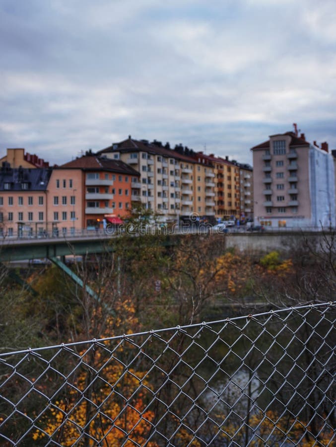 View of Buildings in City Behind Fence Stock Image - Image of design ...