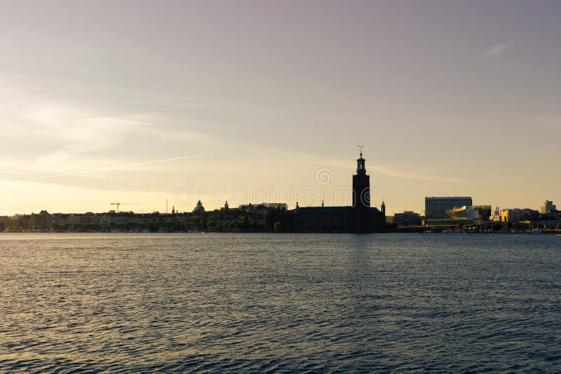 View of Buildings at Waterfront during Sunset Stock Image - Image of ...