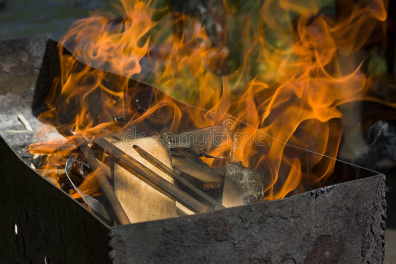 Of a Burning Fire with a Bright Flame in the Grill on a Blurred ...