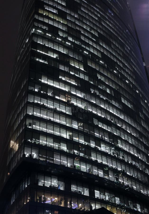 View of the Burning Windows of the Modern Office Building at Night. the ...
