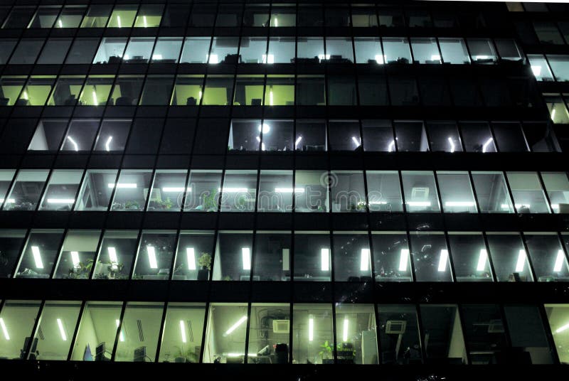 View of the Burning Windows of the Modern Office Building at Night. the ...