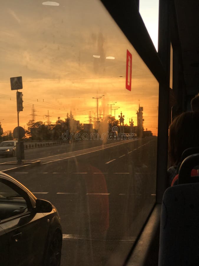View from the Bus Window on the Road of the City Avenue during Sunset ...