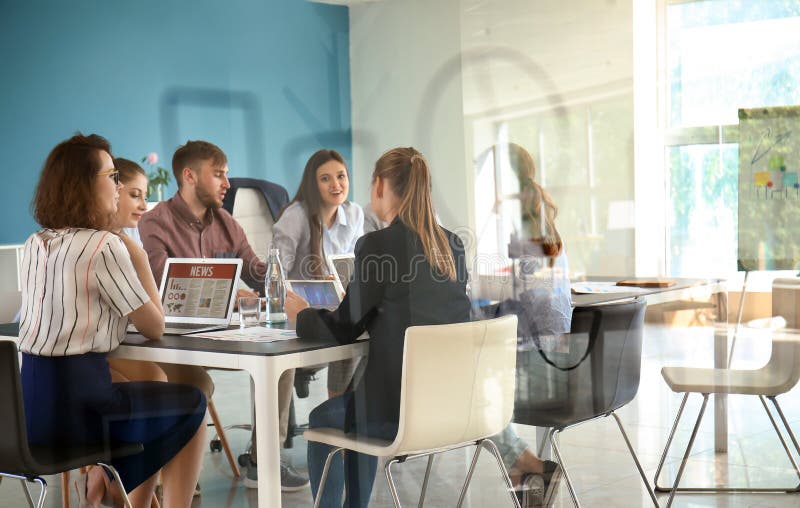 View at Business Team during Meeting in Office through Transparent ...