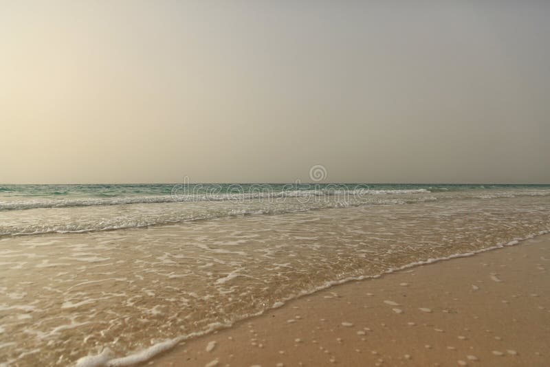 View on the Calm Sea from an Empty Sandy Beach at Sunset Stock Photo ...