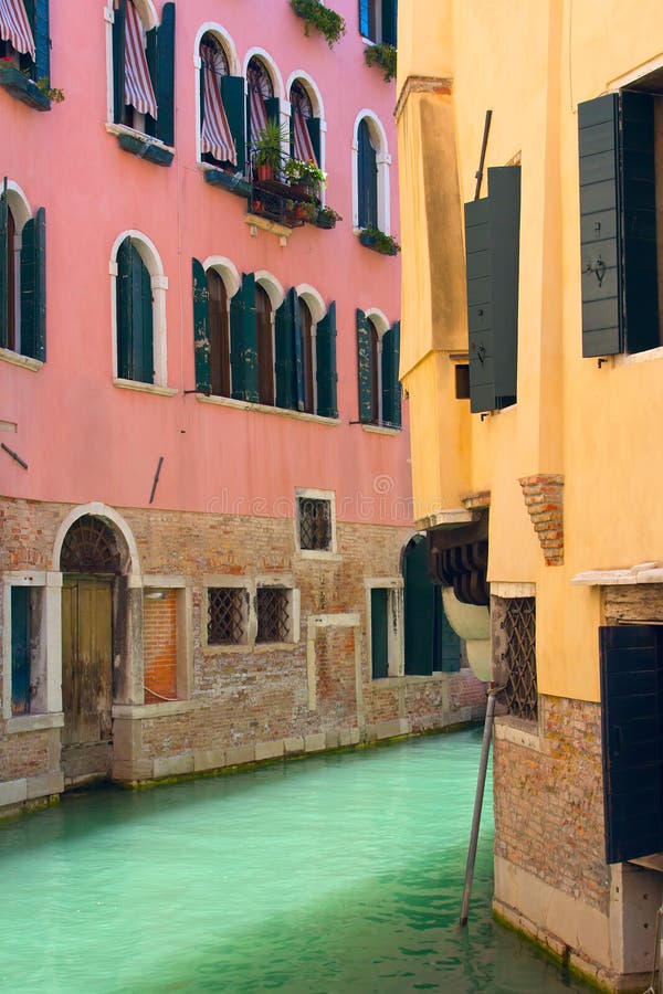 View of Canal in Venice with Pink and Yellow House Stock Photo - Image ...