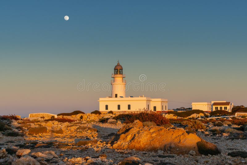 View of the Cap De Cavalleria Lighthouse on Menorca at Sunset with a ...