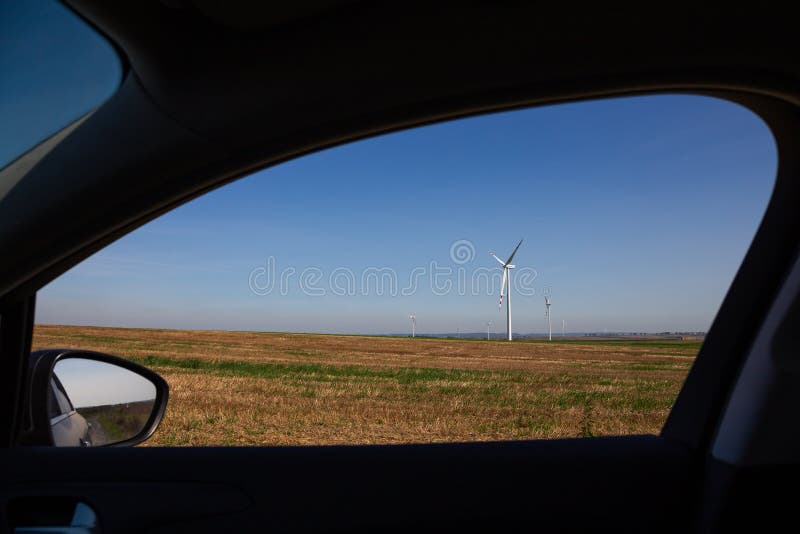 View from the Car into the Fields with Wind Farms Stock Image - Image ...