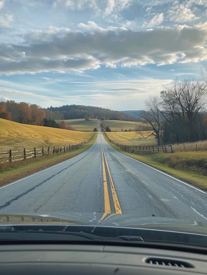 View through a Car Windshield of an Open Road Stretching into the ...