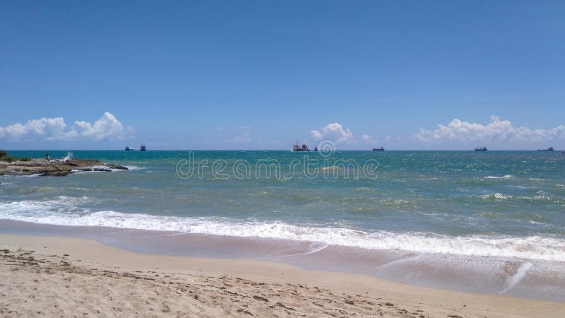 View of Cargo Ships from the Beach Stock Photo - Image of cape, cove ...