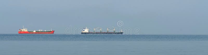 A View of Cargo Ships Moving Far Across the Sea. Stock Photo - Image of ...