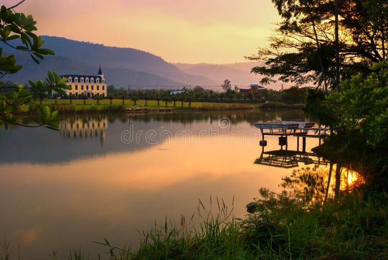 View of the Castle in the Mountain with a Lake at the Sunset Stock ...