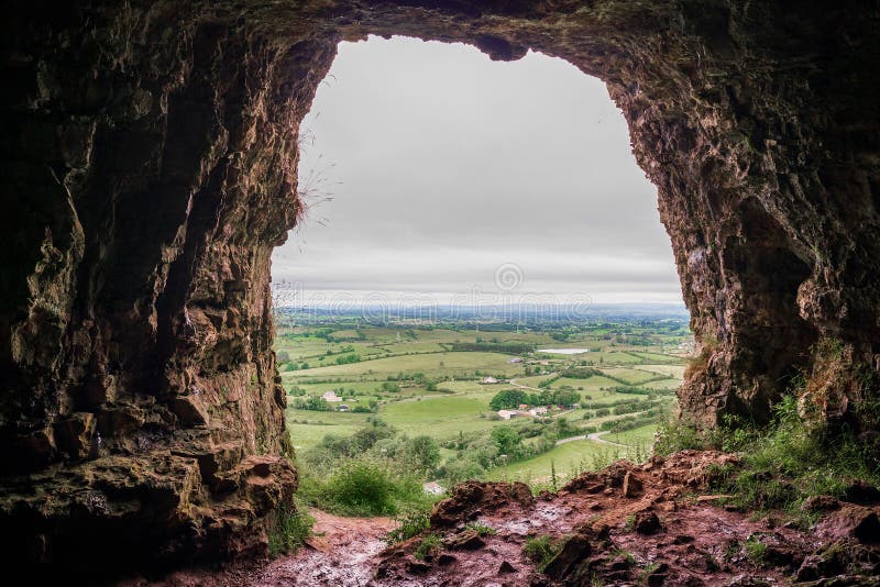 View from a Cave on a Beautiful Scenery. Cloudy Sky. Natural Frame ...