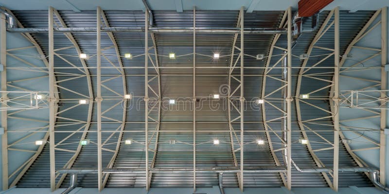 View of the Ceiling of a Huge Metal Hangar with Metal Frames with Lamps ...