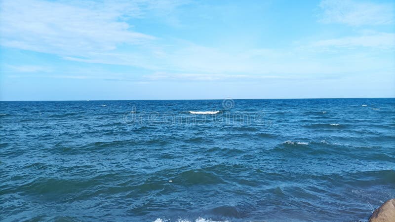 View of a choppy beach stock photo. Image of blue, islands - 277082018