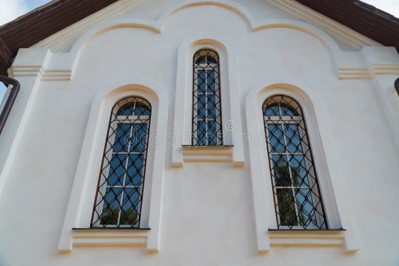 View of the Church Wall of White Stone with Three Windows. Stock Photo ...