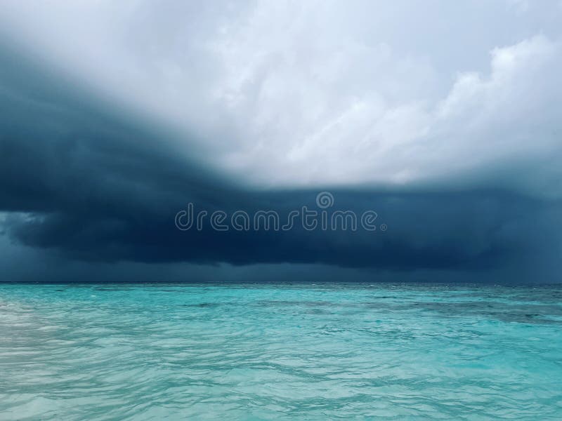 View on a Clean Ocean Water with Thunder Clouds on Horizon Stock Photo ...